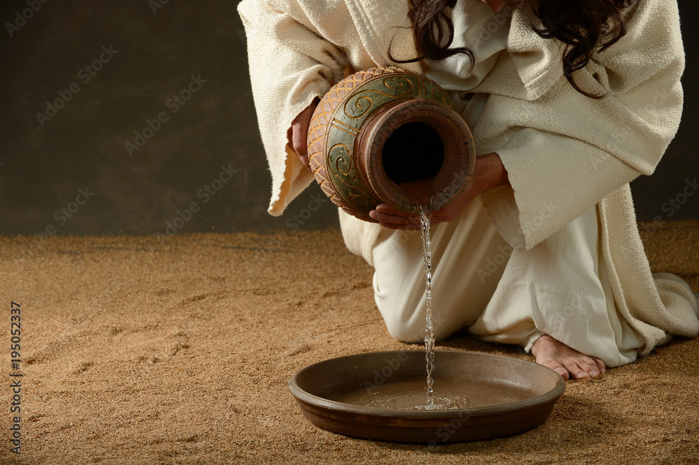 Jesus pouring water Stock Photo | Adobe Stock