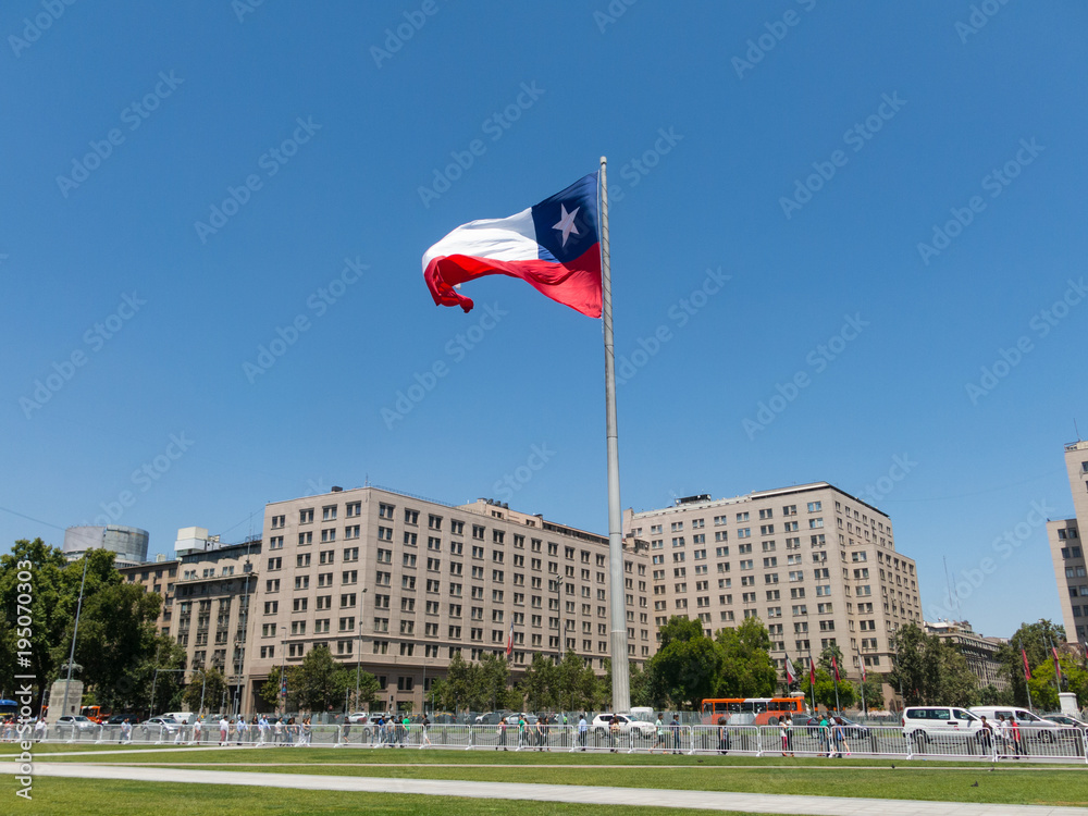 Chileans walking near the giant flag on Avenida La Alameda with the ...