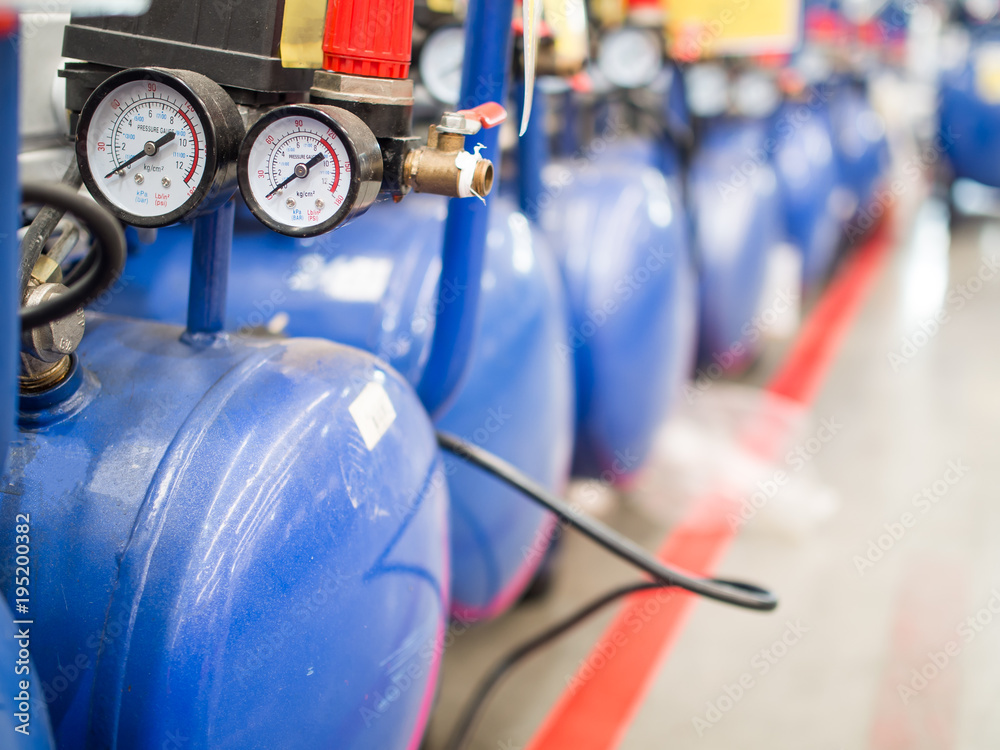 Air tank with pressure gauge. Stock Photo | Adobe Stock