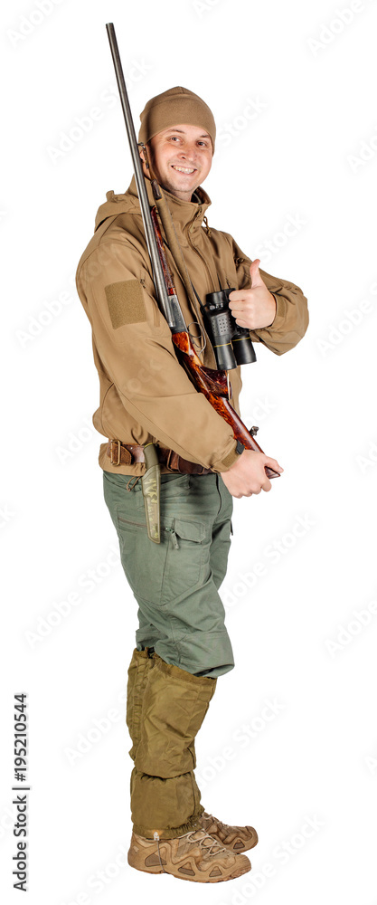 Full length portrait of a male hunter with double barreled shotgun ...