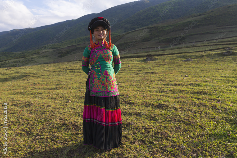 Beautiful Chinese Yi people in traditional costumes outdoor Stock Photo | Adobe Stock