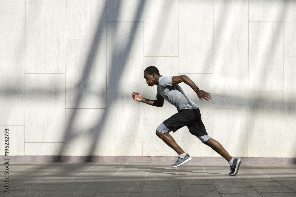 Man in motion of running Stock Photo | Adobe Stock