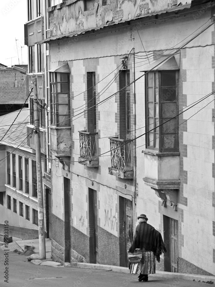 Chola walking in the streets of Bolivia with traditional coya clothing ...