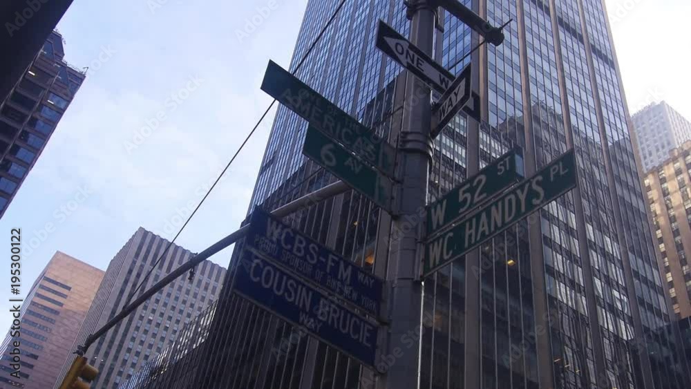Road Direction Sign In Front Of Buildings From Below - Slide Right To ...