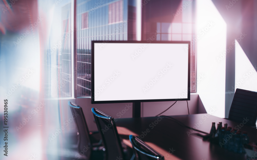 Template of empty white presentation screen at the head of the table in ...