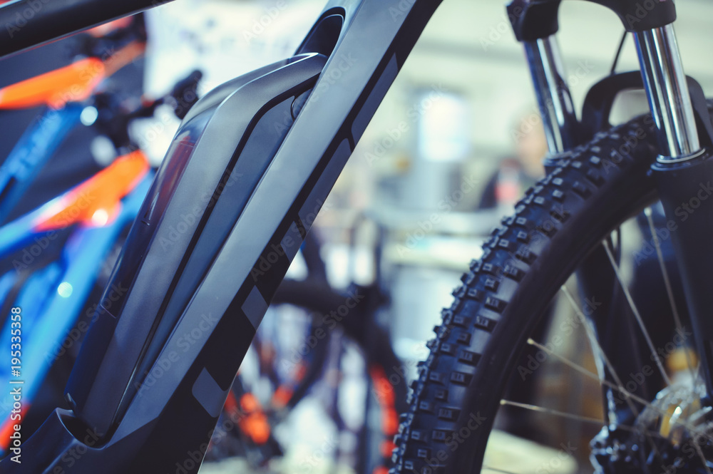 Poster The electric bike battery is mounted on the frame, green ...