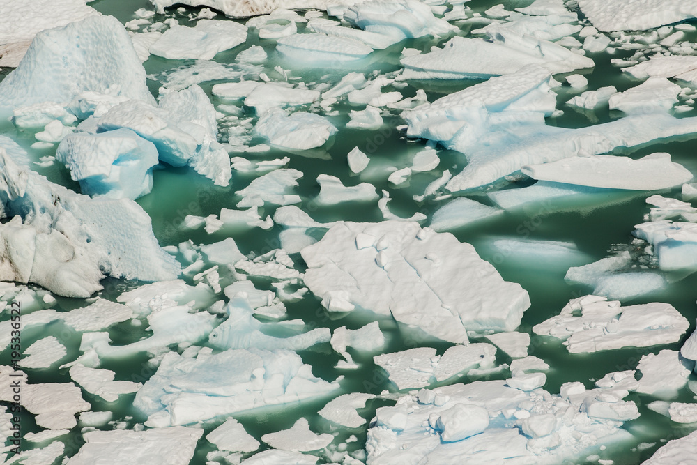 Broken ice cubes in green water Stock Photo | Adobe Stock