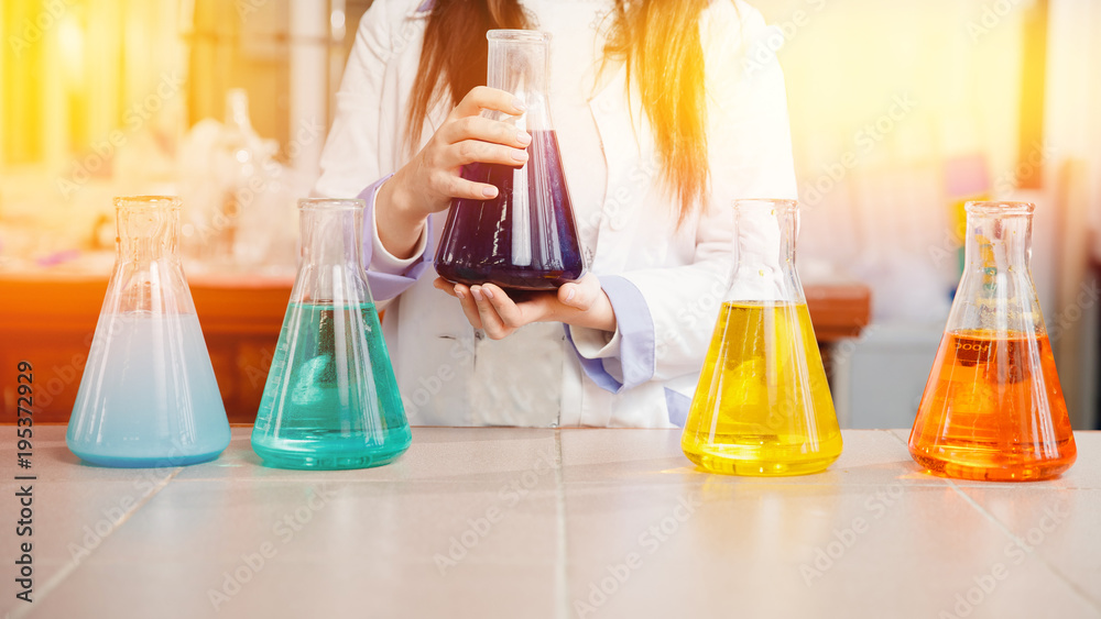 Experiments in chemistry lab set flasks. Conducting an experiment in ...