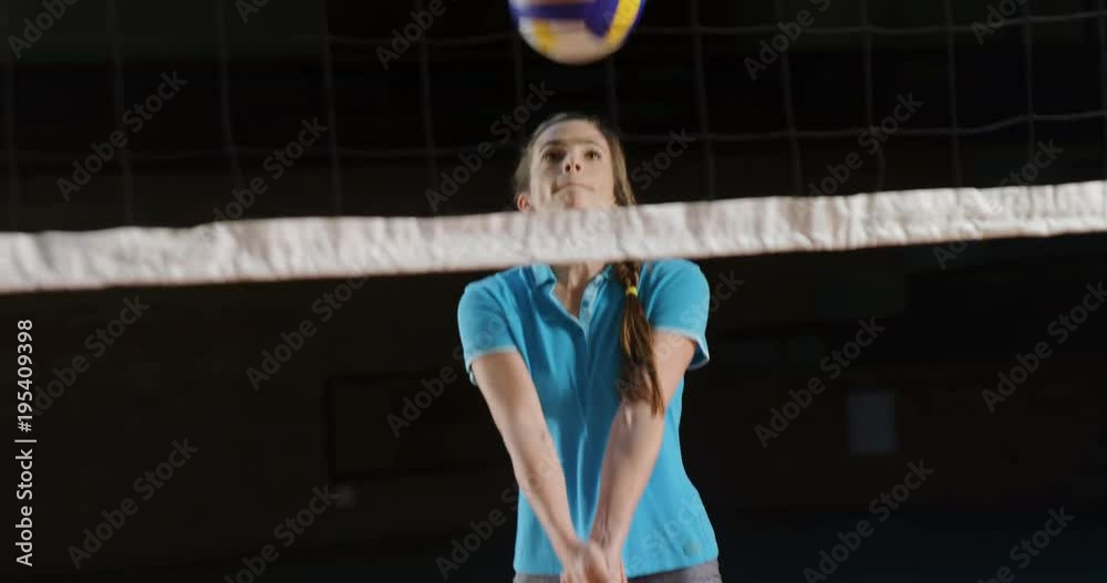 Female player playing volleyball in the court Stock Video | Adobe Stock