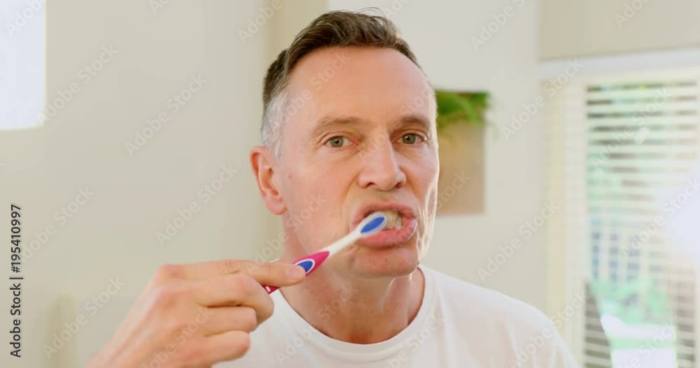 Man brushing his teeth with toothbrush Stock Video | Adobe Stock