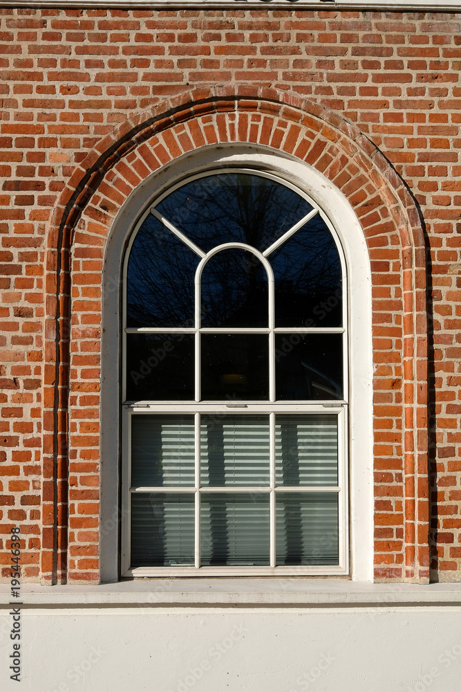 Tall rounded format metal barn style window with designed glazing ...