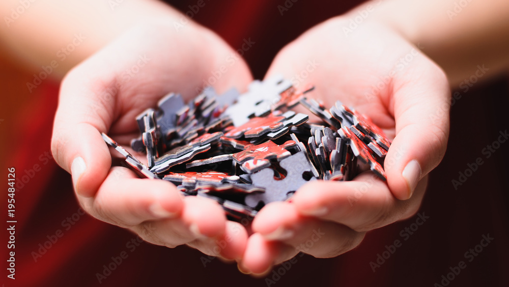 Jigsaw Puzzle Game: Hands together of a woman holding a bunch of puzzle ...