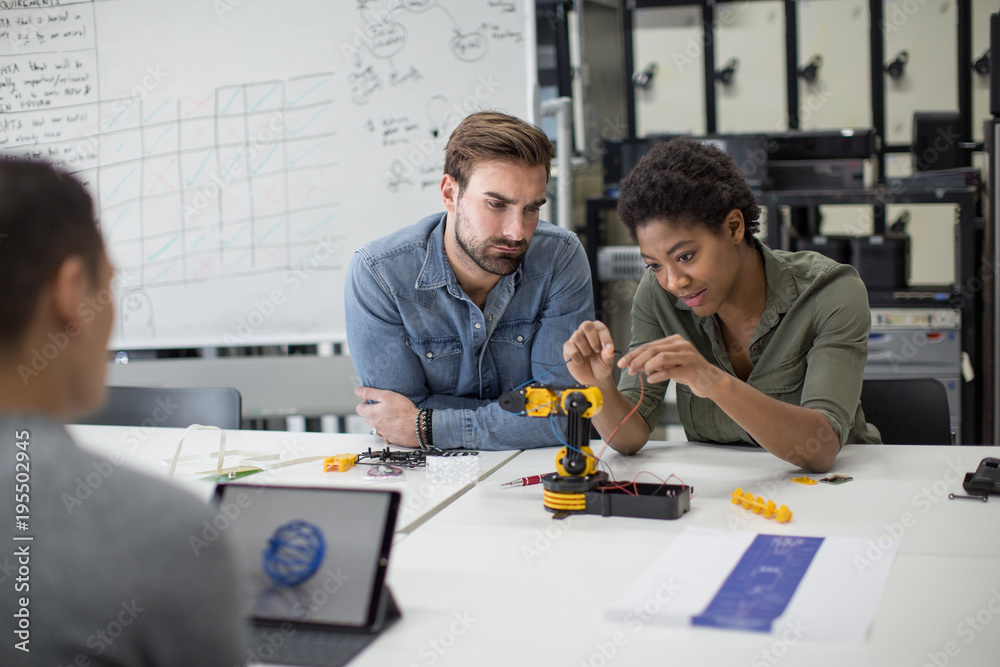 Team working on robotic technology Stock-Foto | Adobe Stock