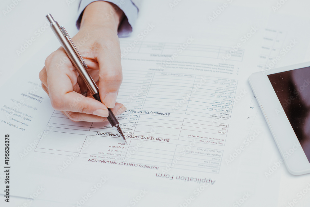 Female hand writing application form Stock Photo | Adobe Stock