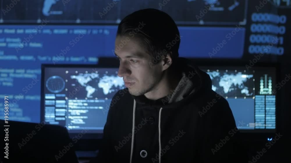Young Geek Hacker programmer is working on computer in cyber security ... Young Geek Hacker programmer is working on computer in cyber security ...