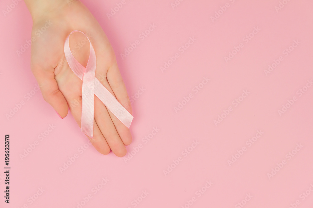 Woman's hand with pink tape as symbol of women illness mammary cancer ...