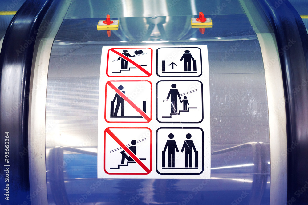 Signs on the escalator. Warning signs on the escalator in the metro ...
