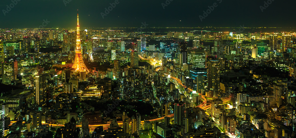 Panorama of Tokyo Skyline at night with illuminated iconic Tokyo Tower from Mori Tower, the ...