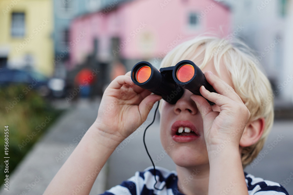 Child using binoculars Stock Photo | Adobe Stock