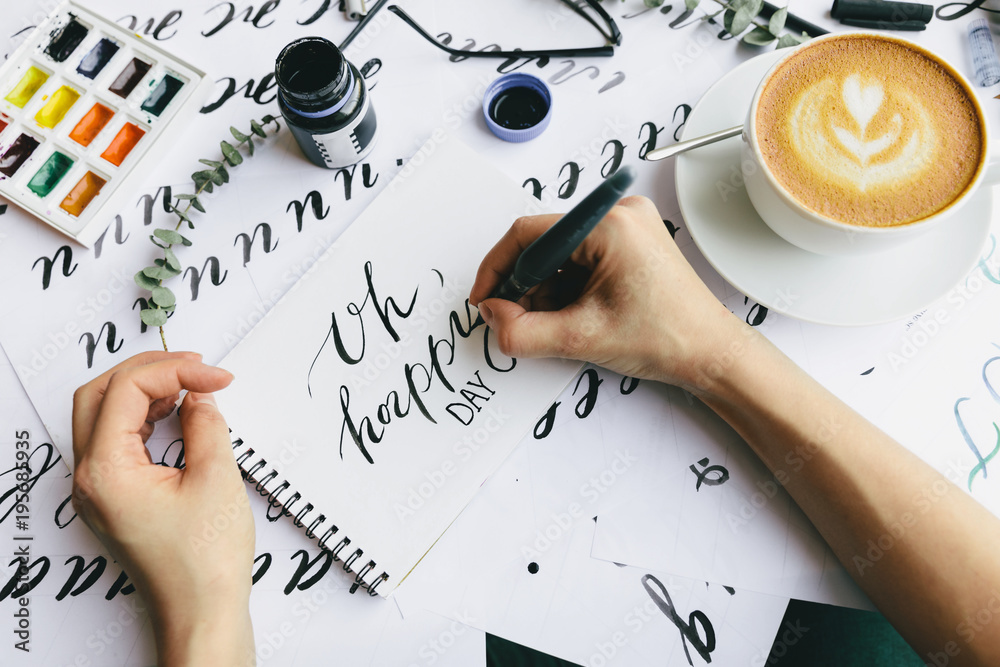 Hands writing with ink in notepad Stock Photo | Adobe Stock