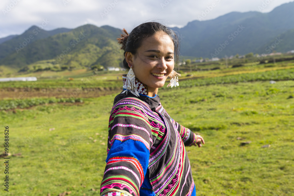 Beautiful Chinese Yi people in traditional costumes outdoor Stock Photo ...