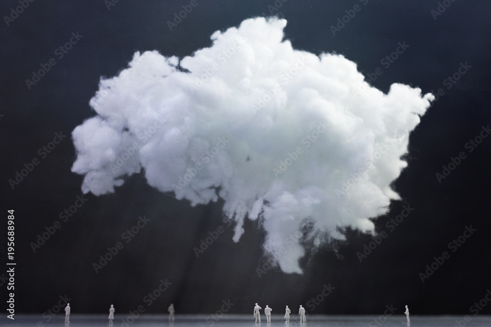 View of white fluffy clouds above a group of tiny people Stock Photo ...