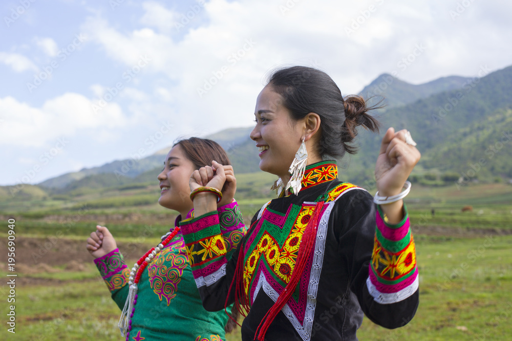 Beautiful Chinese Yi people in traditional costumes outdoor Stock Photo ...