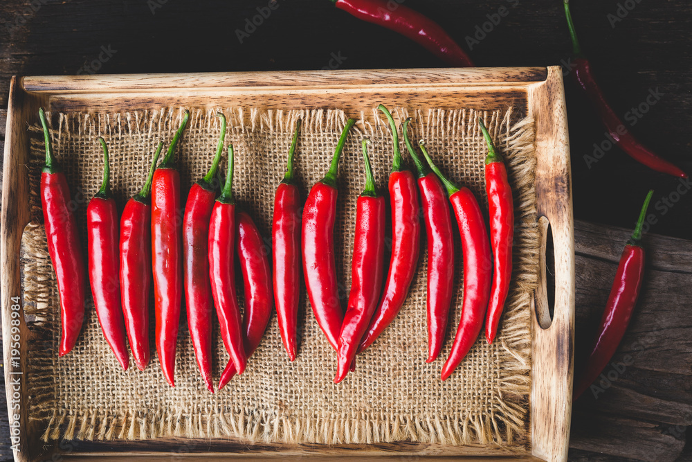 Red chillies on the dark background Stock Photo | Adobe Stock