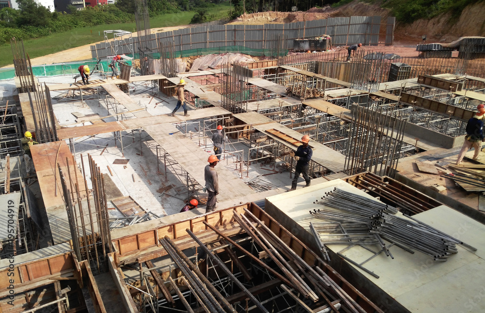 Construction workers fabricated timber form work at the construction ...