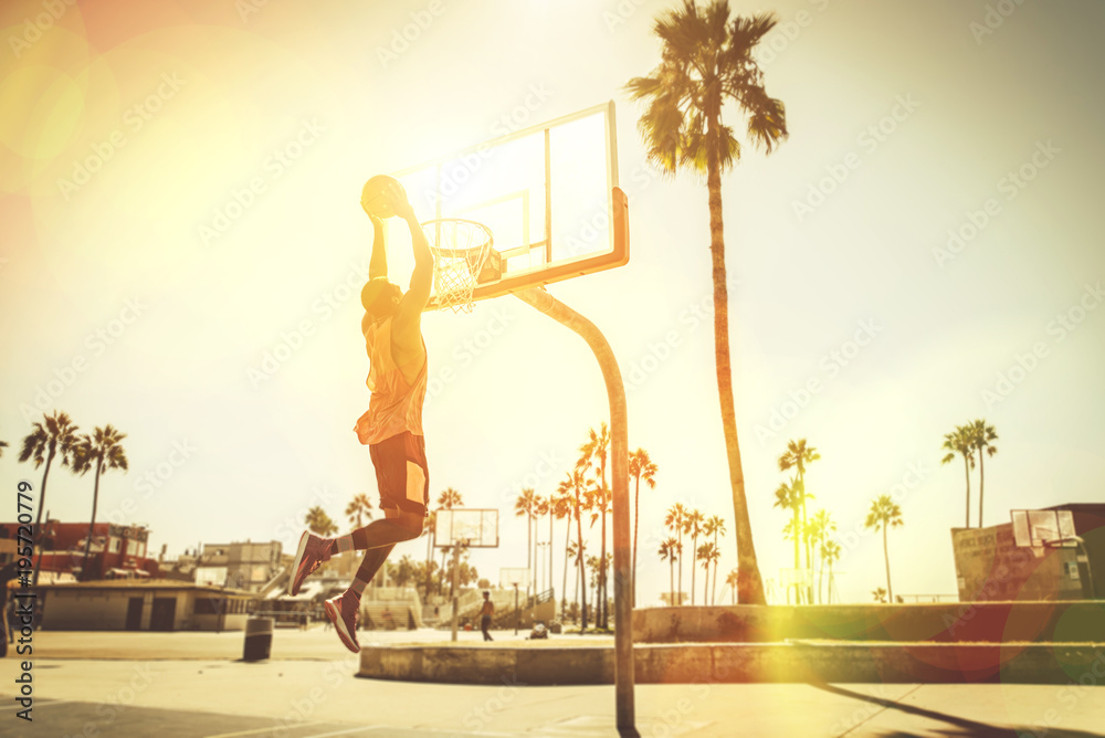 Basketball slam dunk on a californian court Stock Photo | Adobe Stock