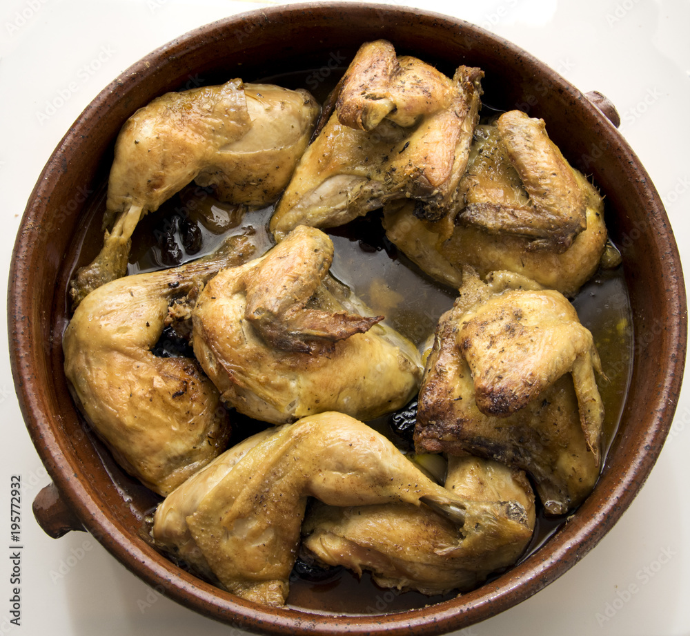 Pollo troceado cocinado al horno con especies. Stock Photo | Adobe Stock