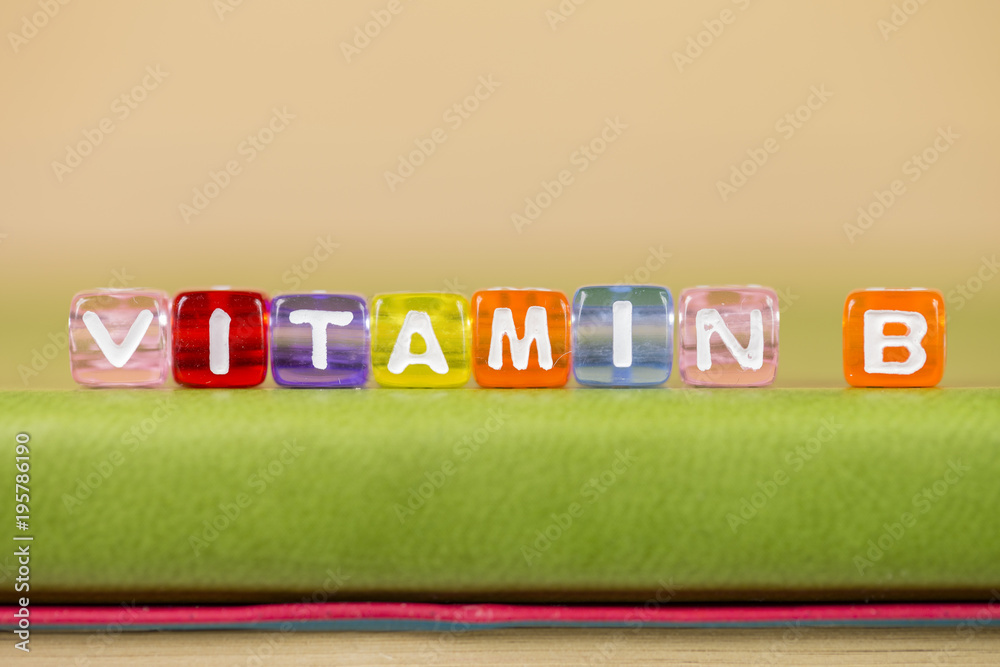 color cube figure with word vitamin b on green book Stock Photo | Adobe ...