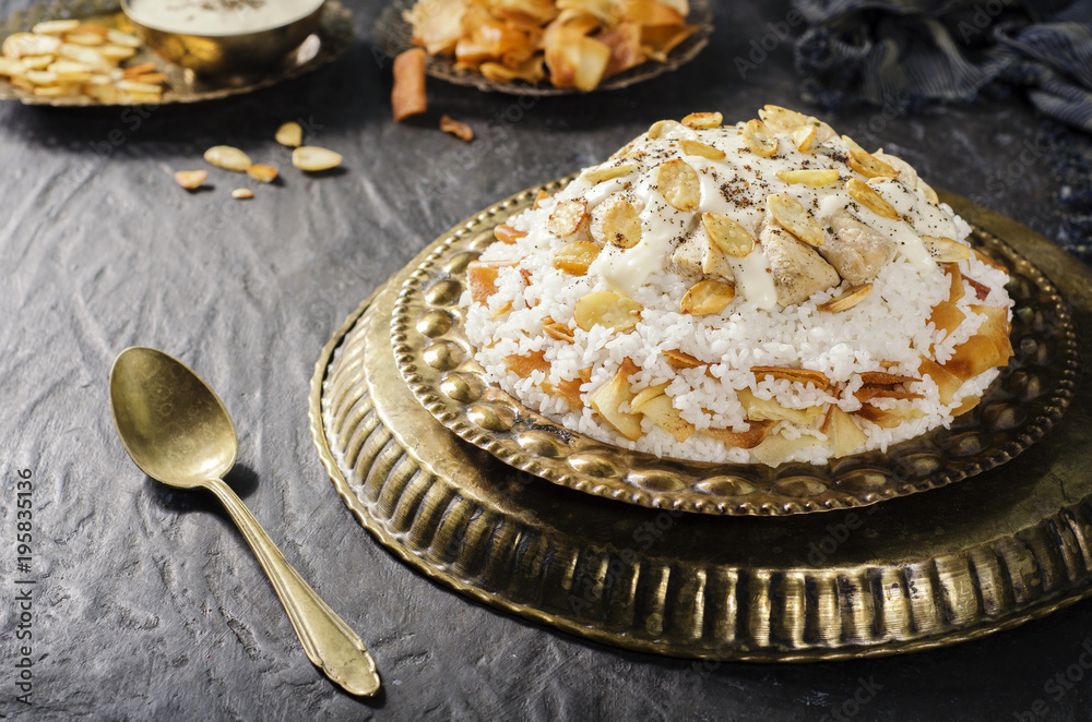 Foto de Arabic cuisine; Jordanian Chicken Mansaf of white rice and ...