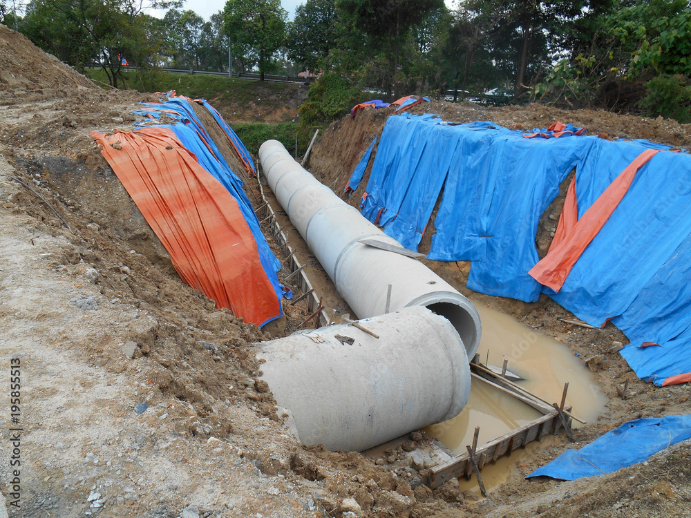 Precast concrete round culvert drain under construction at the ...