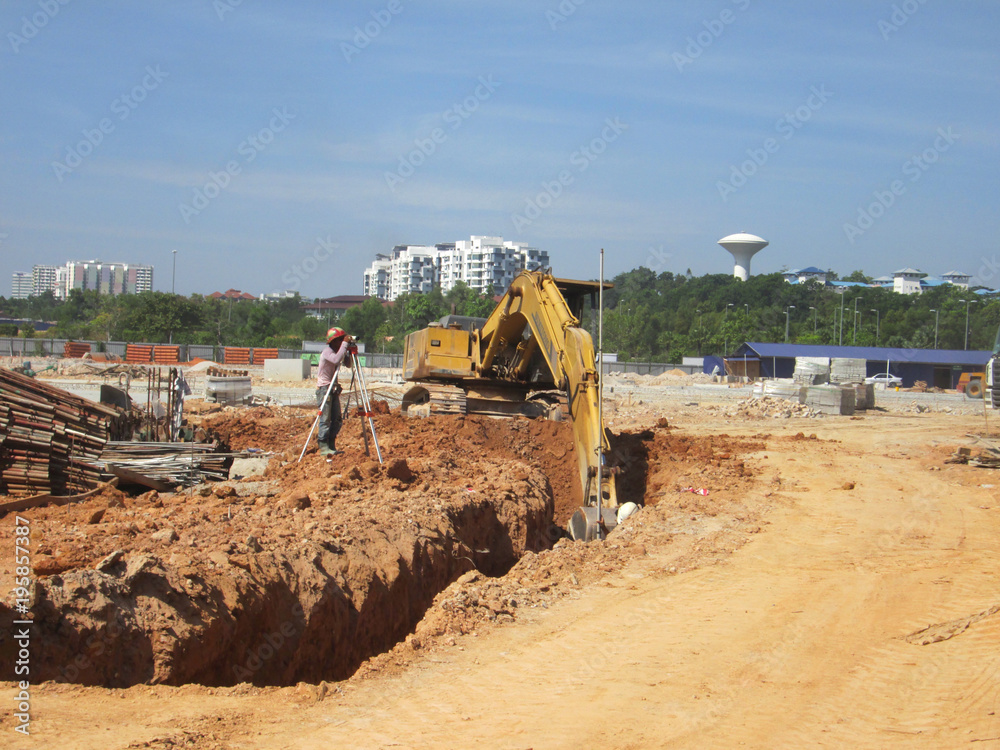Underground utilities trenches under construction. Construction workers ...
