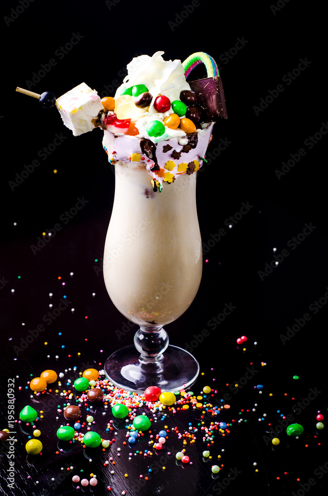 Crazy freakshake food trend. Delicious extreme milkshake with ice cream ...