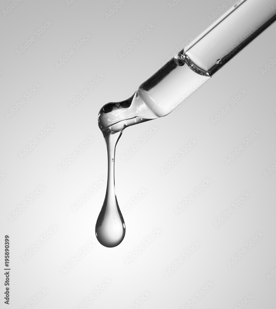 Liquid drop from laboratory glass Pipette Stock Photo | Adobe Stock