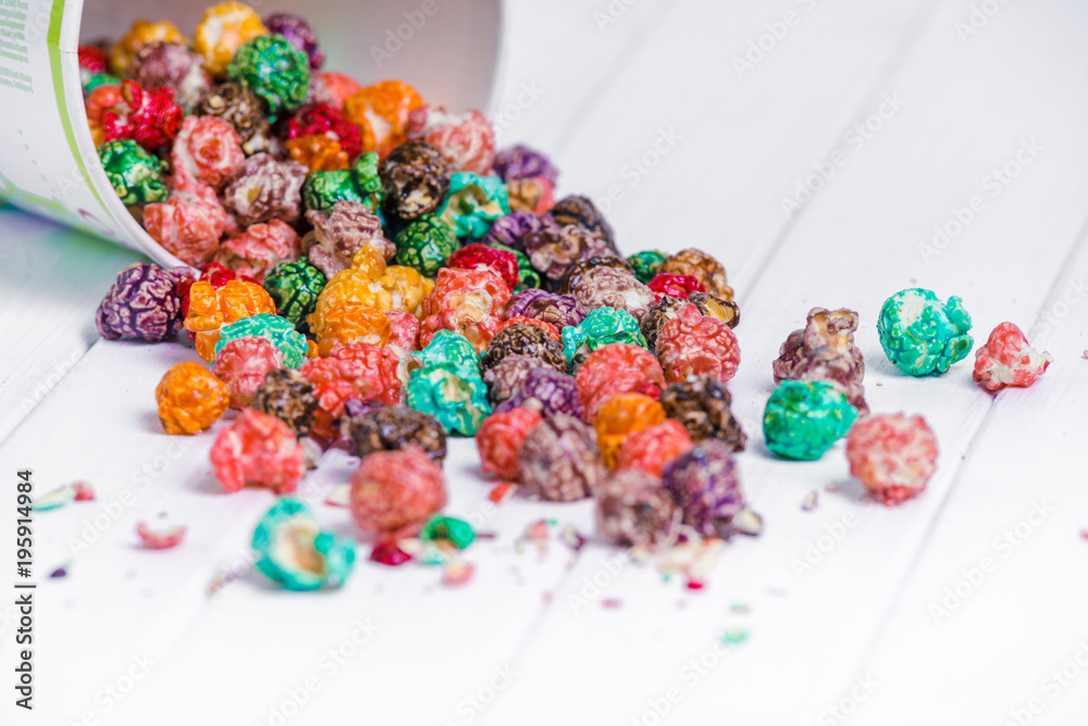 Brightly Colored Candied Popcorn, white background. Horizontal image of ...