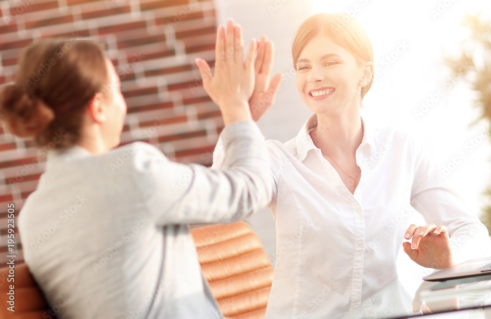 members of the business team giving each other a high five. Stock Photo ...