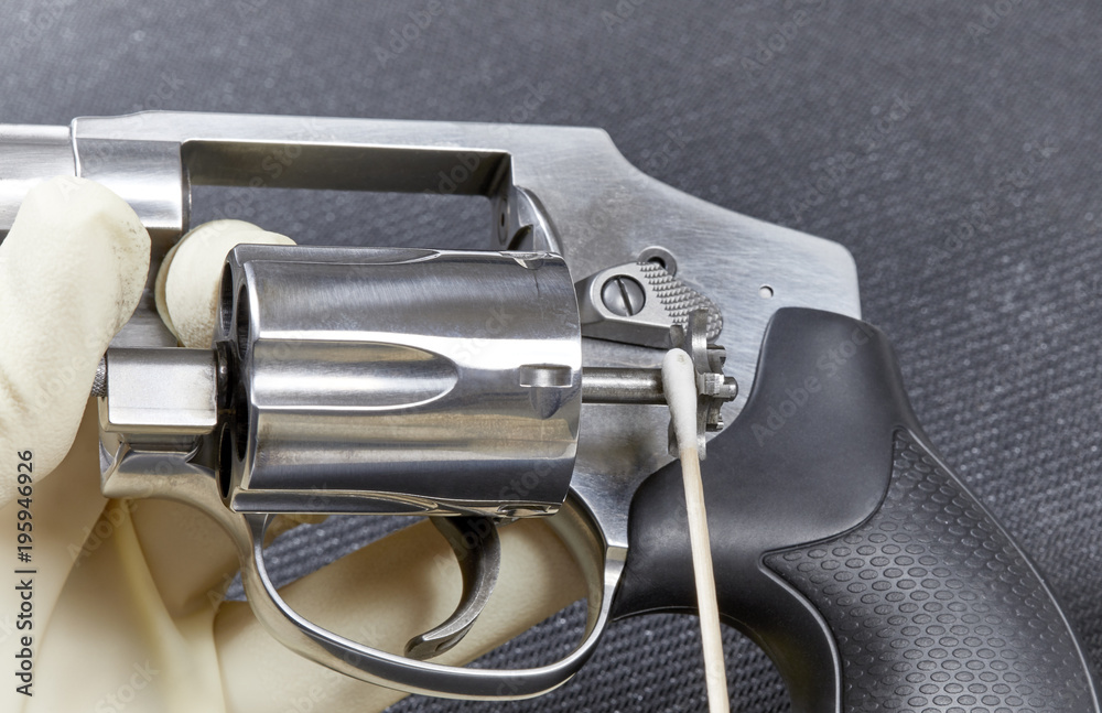 Cleaning the Ejector on a Snubnose Revolver Stock Photo | Adobe Stock