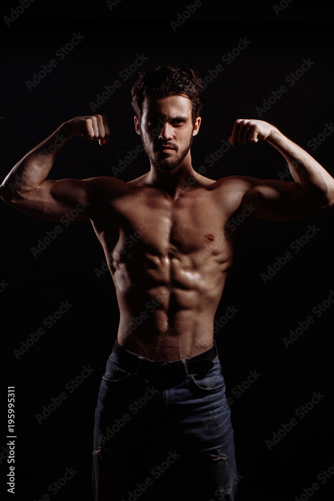 amateur bodybuilder showing his sporty forms.pump iron. tense Stock ...