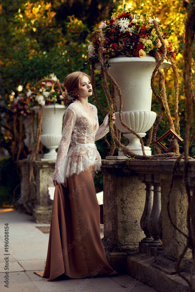 Elegant female model wearing maxi dress and white lace jacket with long ...