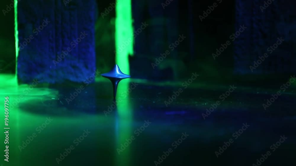 Totem spinning top spinning, wobbling and stopping. Spinning top on ...