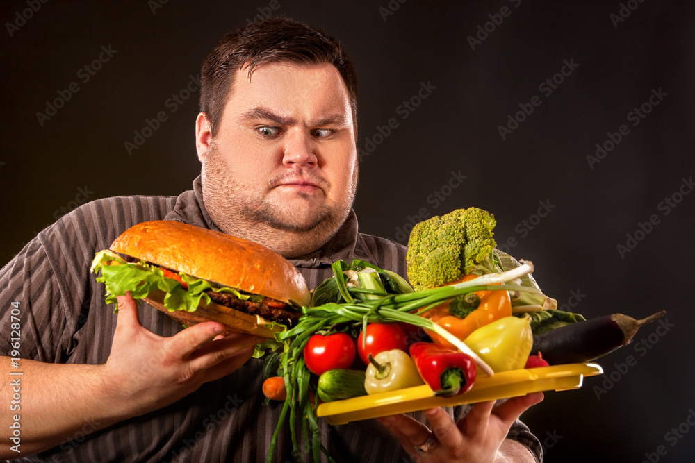 Diet fat man who makes choice between healthy and unhealthy food ...