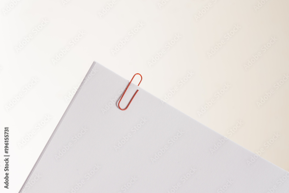 Some white papers clipped together. Represents reminders, documents or ...