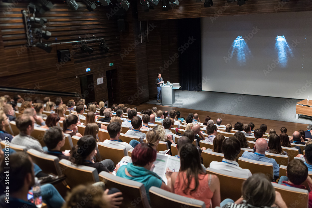 Speaker giving a talk on scientific conference. Audience at the ...