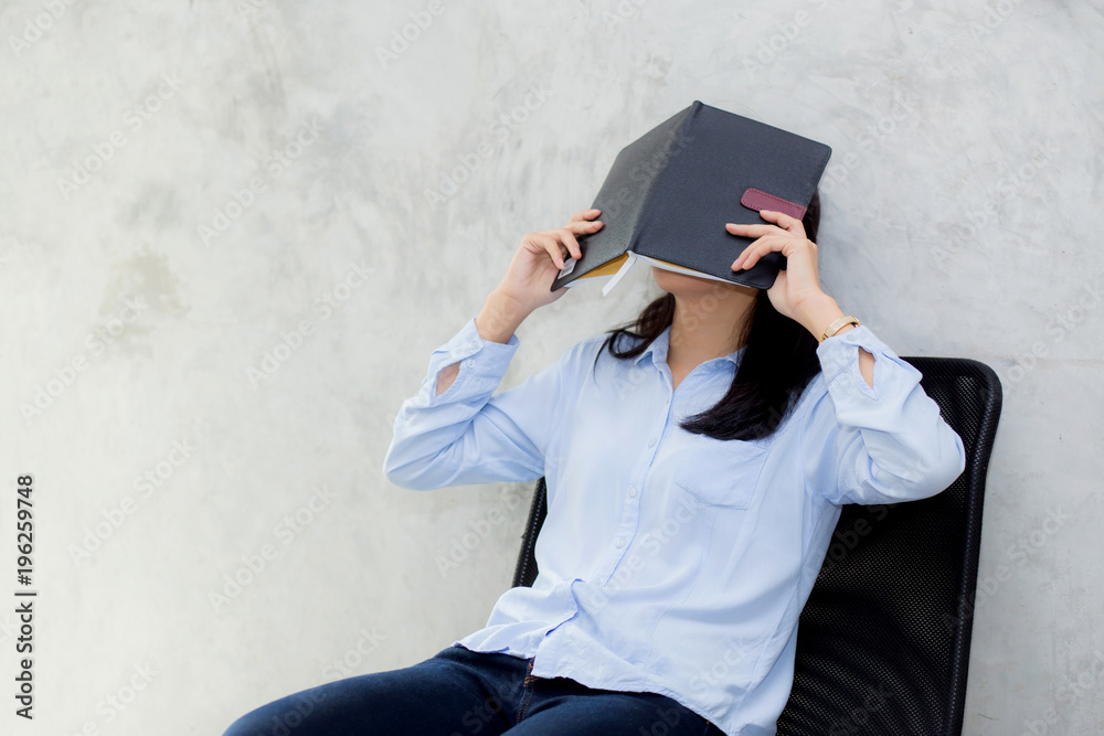 Girl Hiding Face With Book
