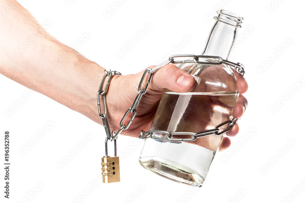 metal chain around the arm in which the alcohol bottle Stock Photo ...