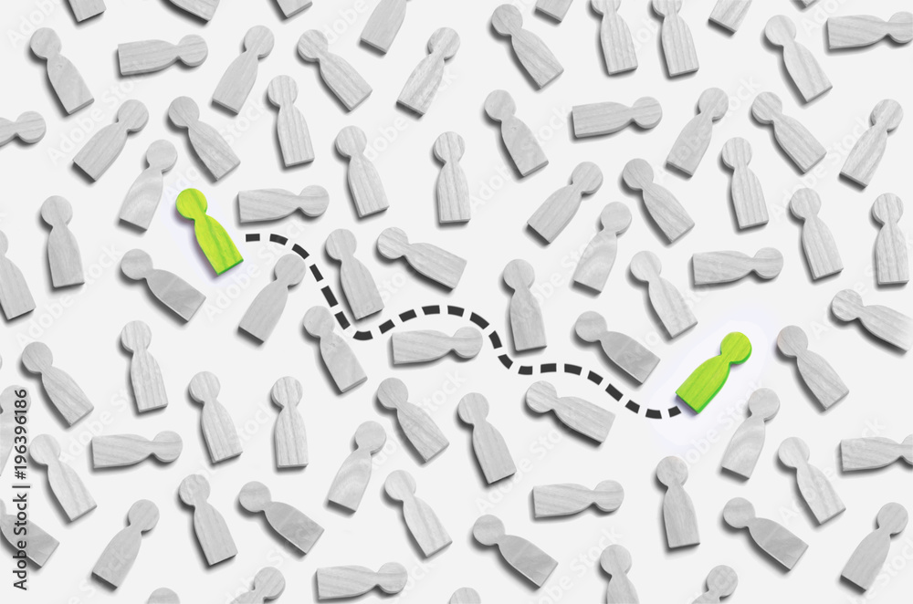 The connection between two persons in a gray crowd of people. The ...