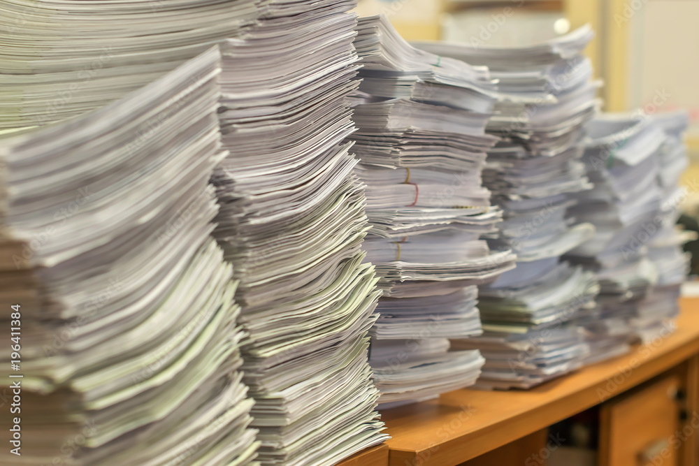 bundles bales of paper documents. stacks packs pile on the desk in the ...